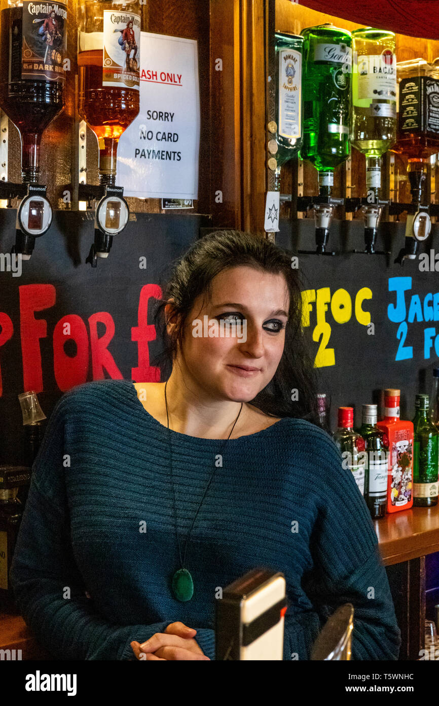 A barmaid at The Five Alls pub poses for photographers. Chepstow street ...
