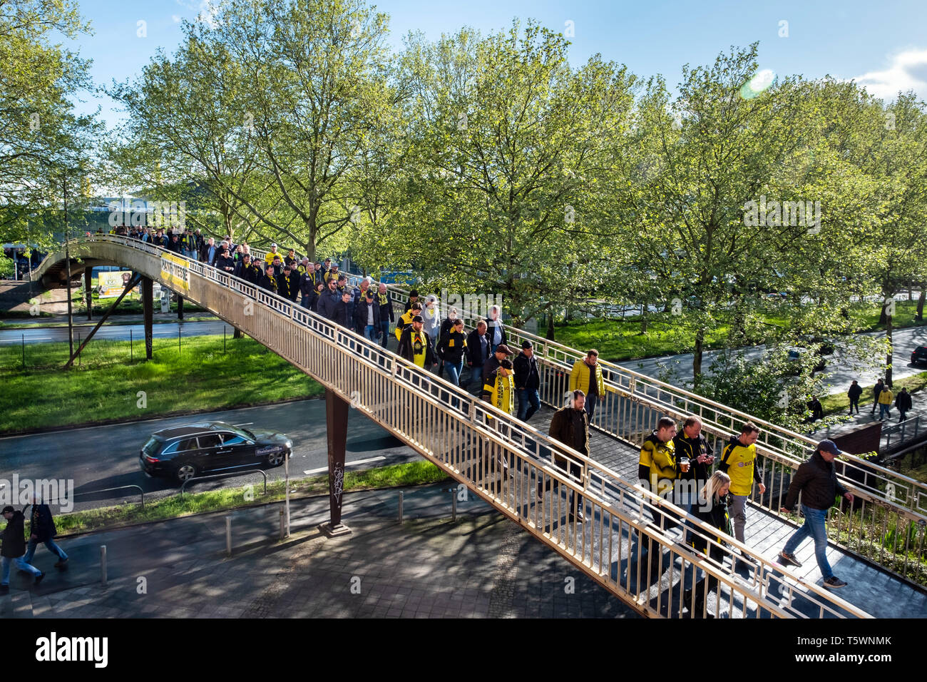 Football fans walk in hi-res stock photography and images - Alamy