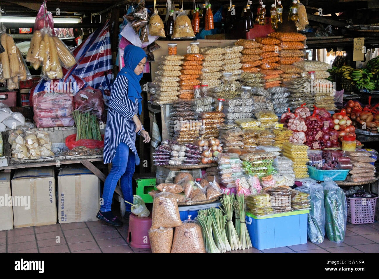 Muslim woman selling snacks and produce at Central Market, Kota ...
