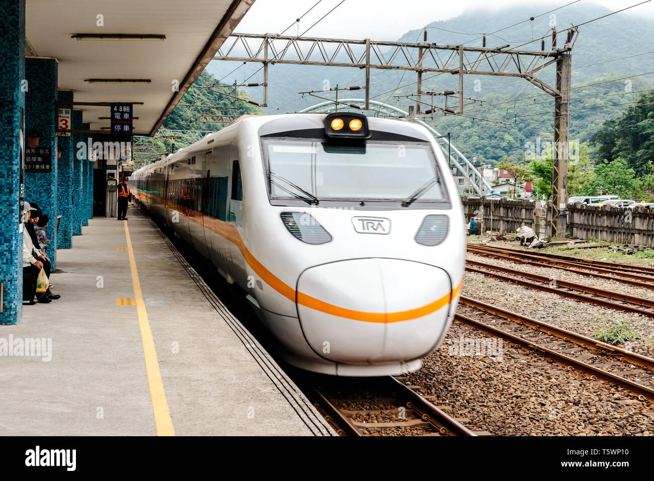 Train approaching the platform at Houtong Station. This station is ...
