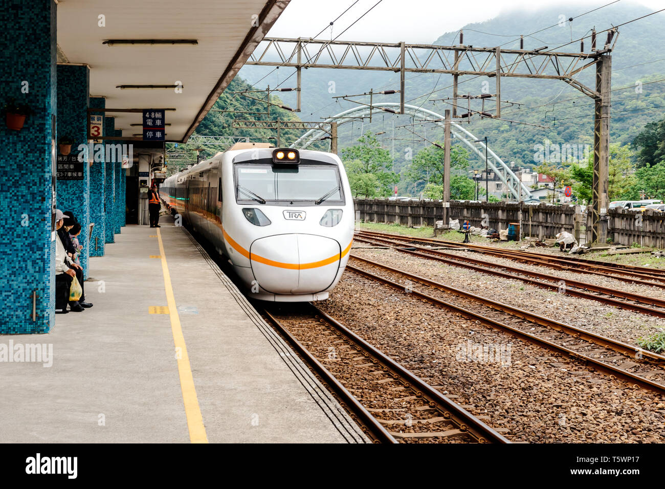 Train approaching the platform at Houtong Station. This station is ...