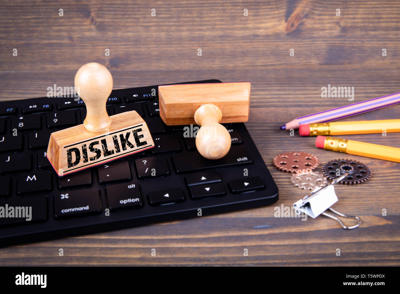 Dislike concept. Computer keyboard and wooden stamps Stock Photo - Alamy