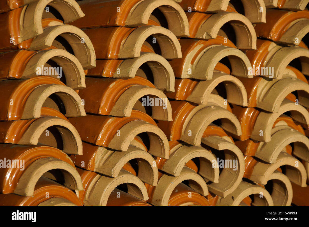 Stacked ceramic roof tiles in Malaysia Stock Photo - Alamy