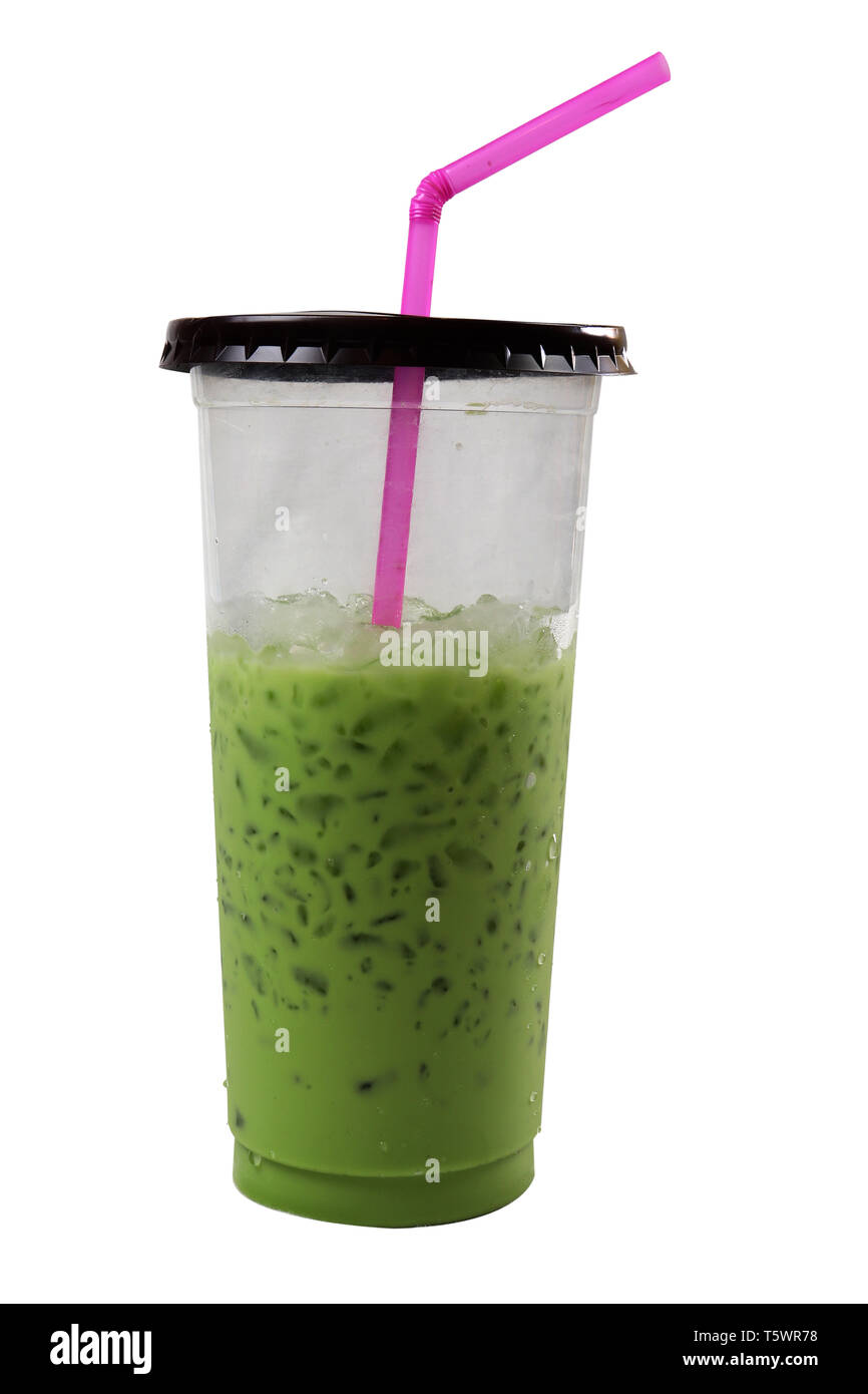 Cool green tea in a plastic glass with a pink tube . isolated on black ...
