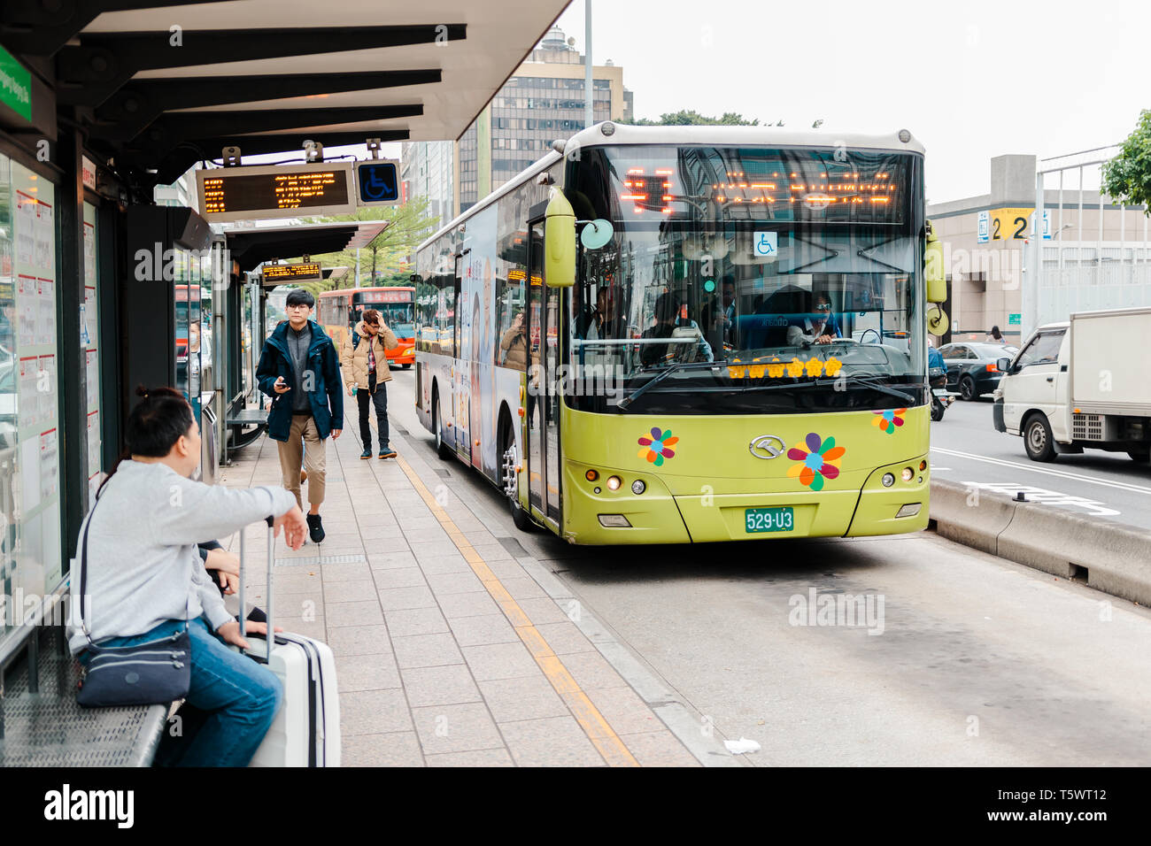 Taiwanese Bus stopping at a bus stop in Taipei City to pick up ...