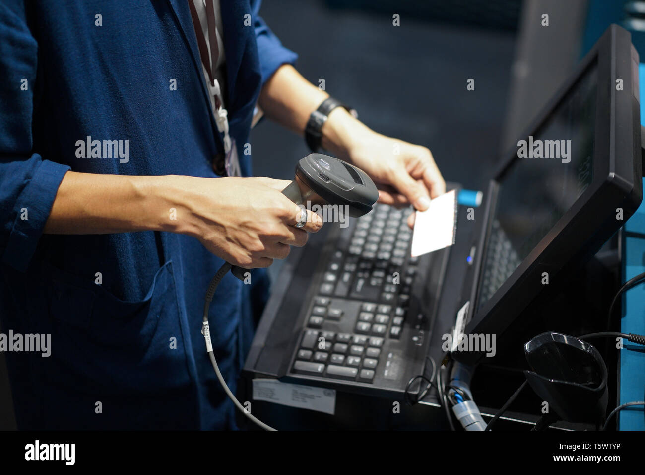 Point of sales shot, barcode or QR code scanning front of computer ...