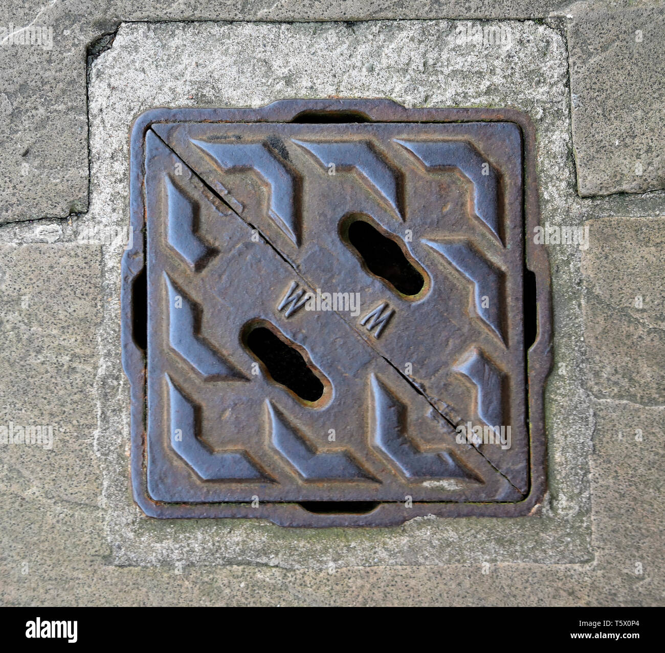 Cast Iron Water stop-cock cover Stock Photo - Alamy