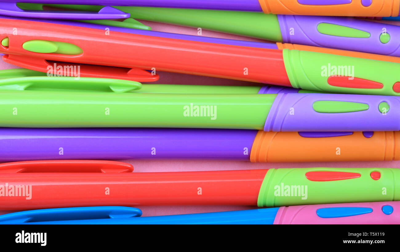 many Ball Pen on Pink Background Stock Photo - Alamy