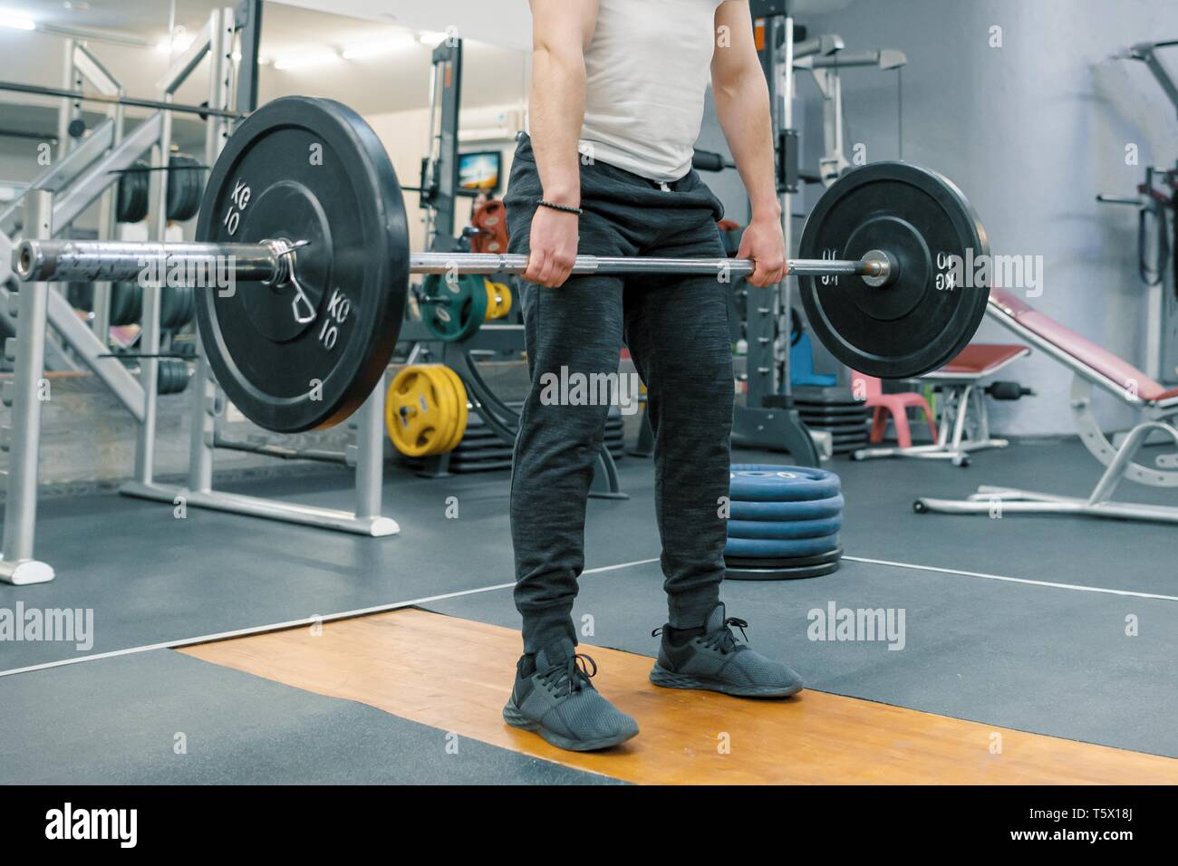 Man lifting arms legs gym hi-res stock photography and images - Alamy