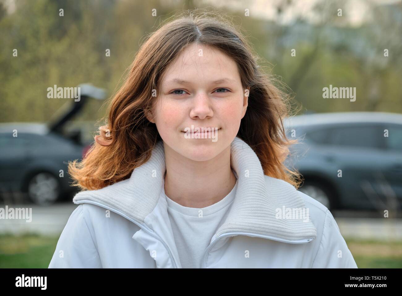 Outdoor portrait of teenager girl 15 years old, girl smiling with long ... Outdoor portrait of teenager girl 15 years old, girl smiling with long ...