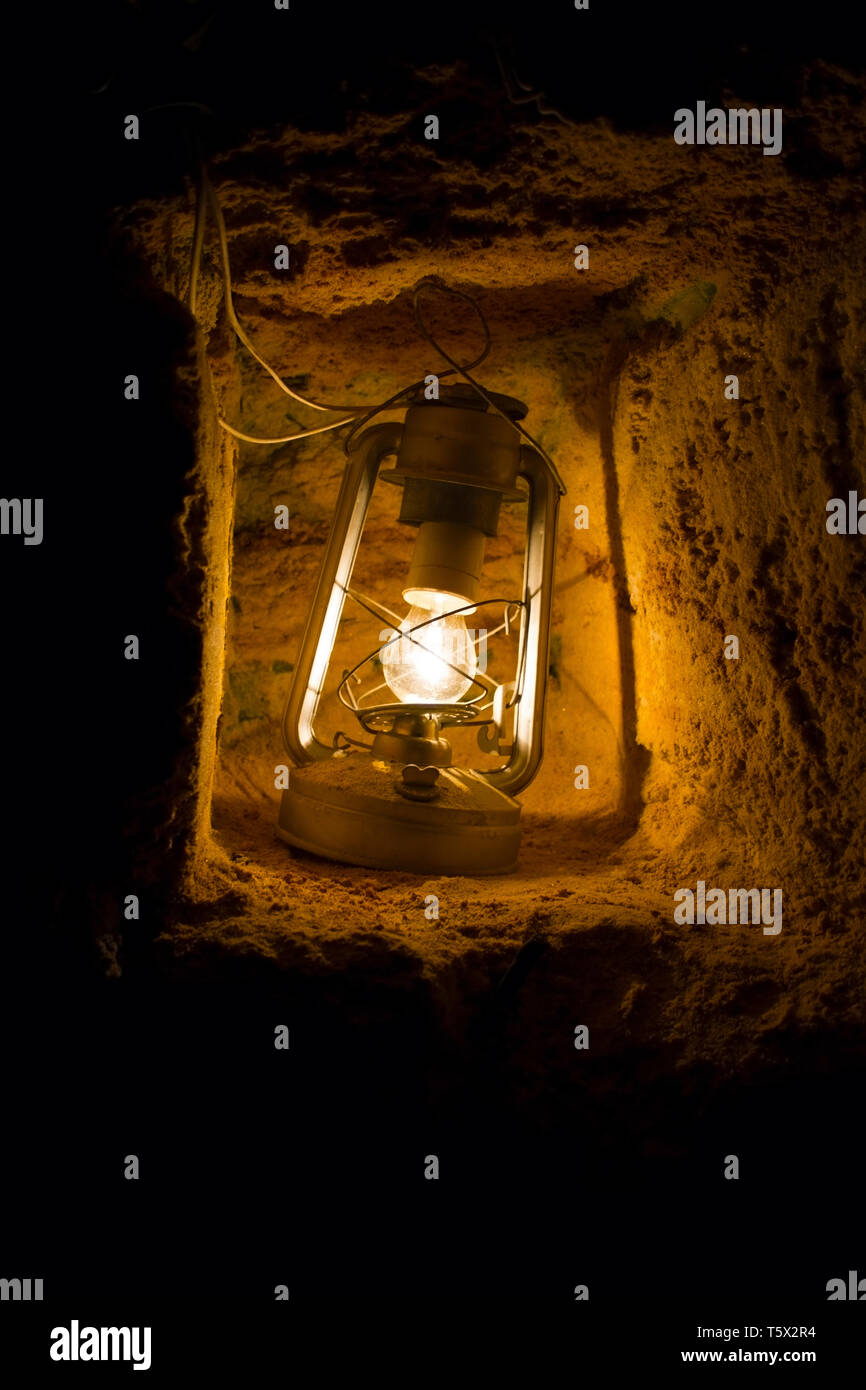 Futuristic electric street lamp glowing in a dark stone cave Stock ...