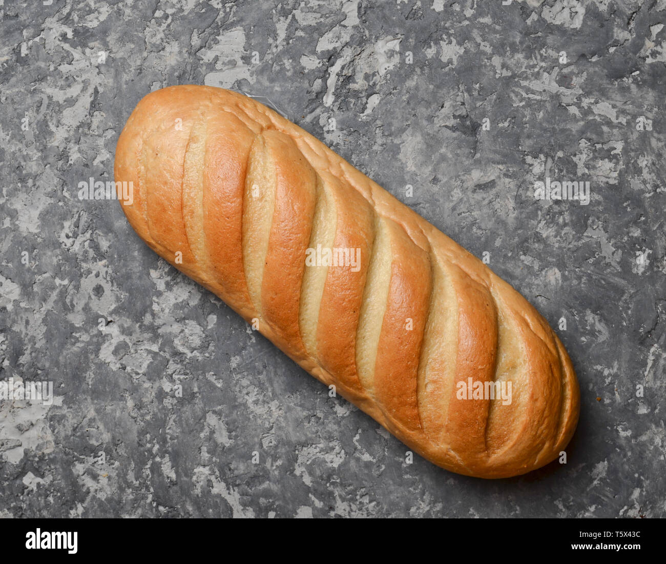 A loaf of wheat bread on a concrete table. Top view Stock Photo - Alamy