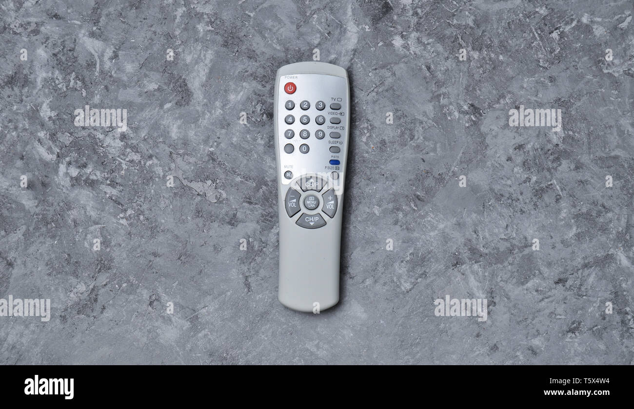 Remote control from TV on a concrete table. Top view Stock Photo - Alamy