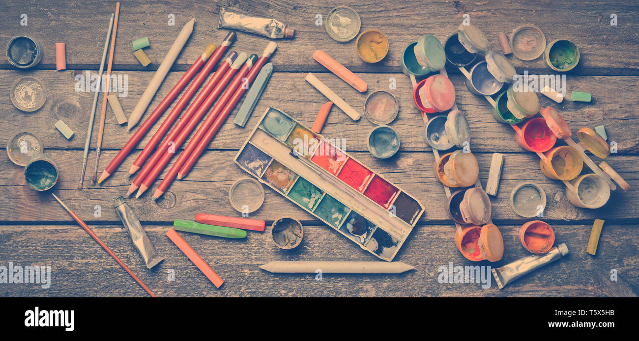 Tools for the artist. Objects for drawing. Paint, crayons, pencils on a ...
