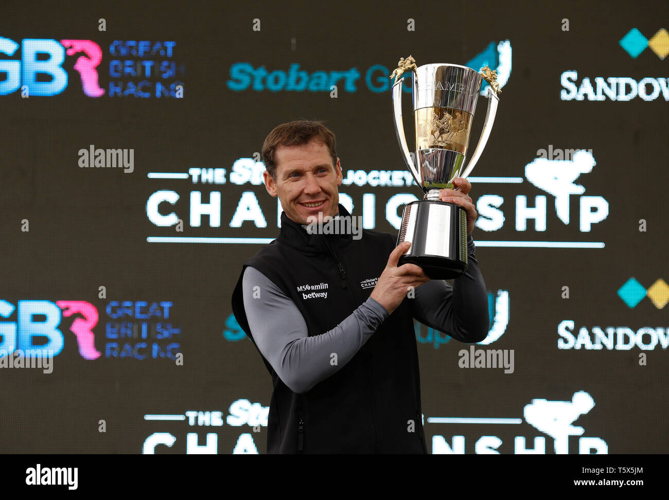 Richard Johnson with the Champion Jump Jockey Trophy at Sandown Park ...