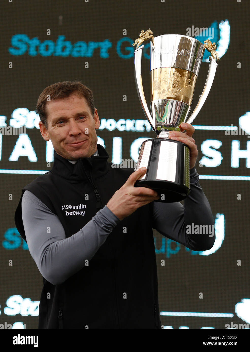 Richard Johnson with the Champion Jump Jockey Trophy at Sandown Park ...