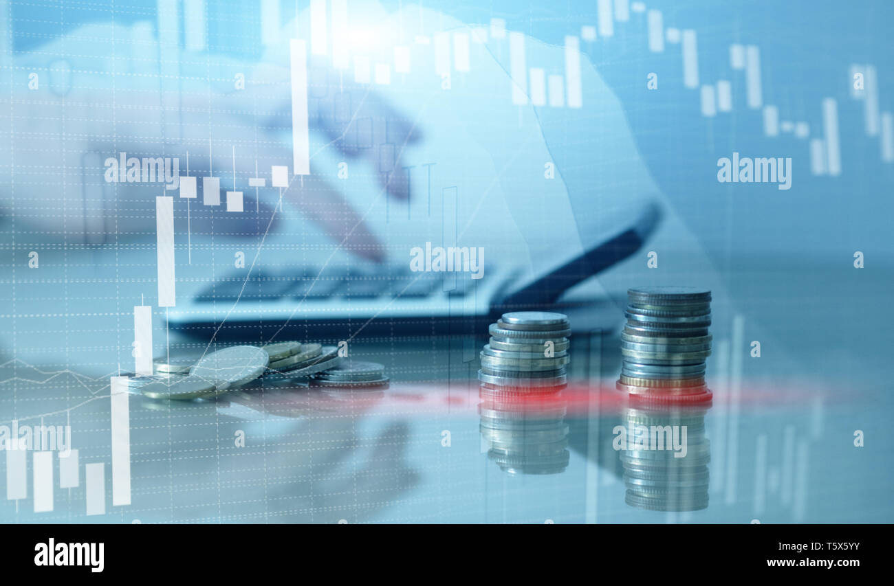 Financial graph chart and rows of coins with calculator Stock Photo - Alamy