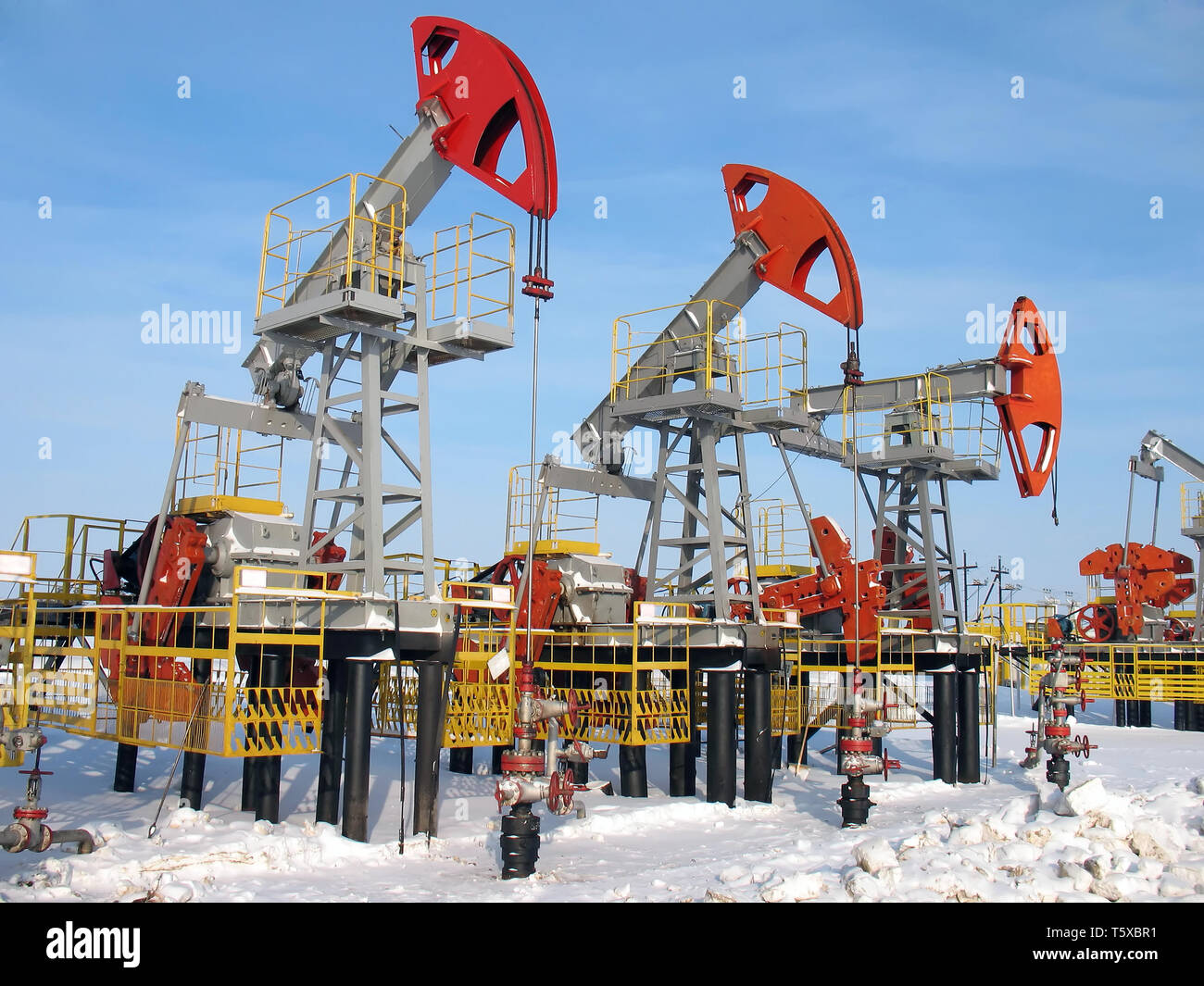 Oil and gas industry. Work of oil pump jack on a oil field Stock Photo ...