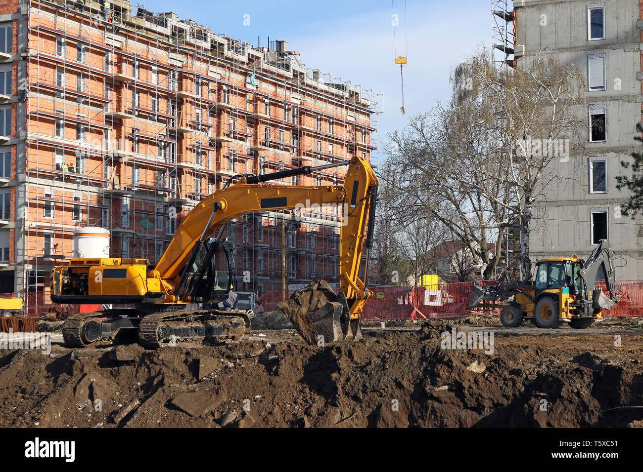 new building construction site and excavators Stock Photo - Alamy