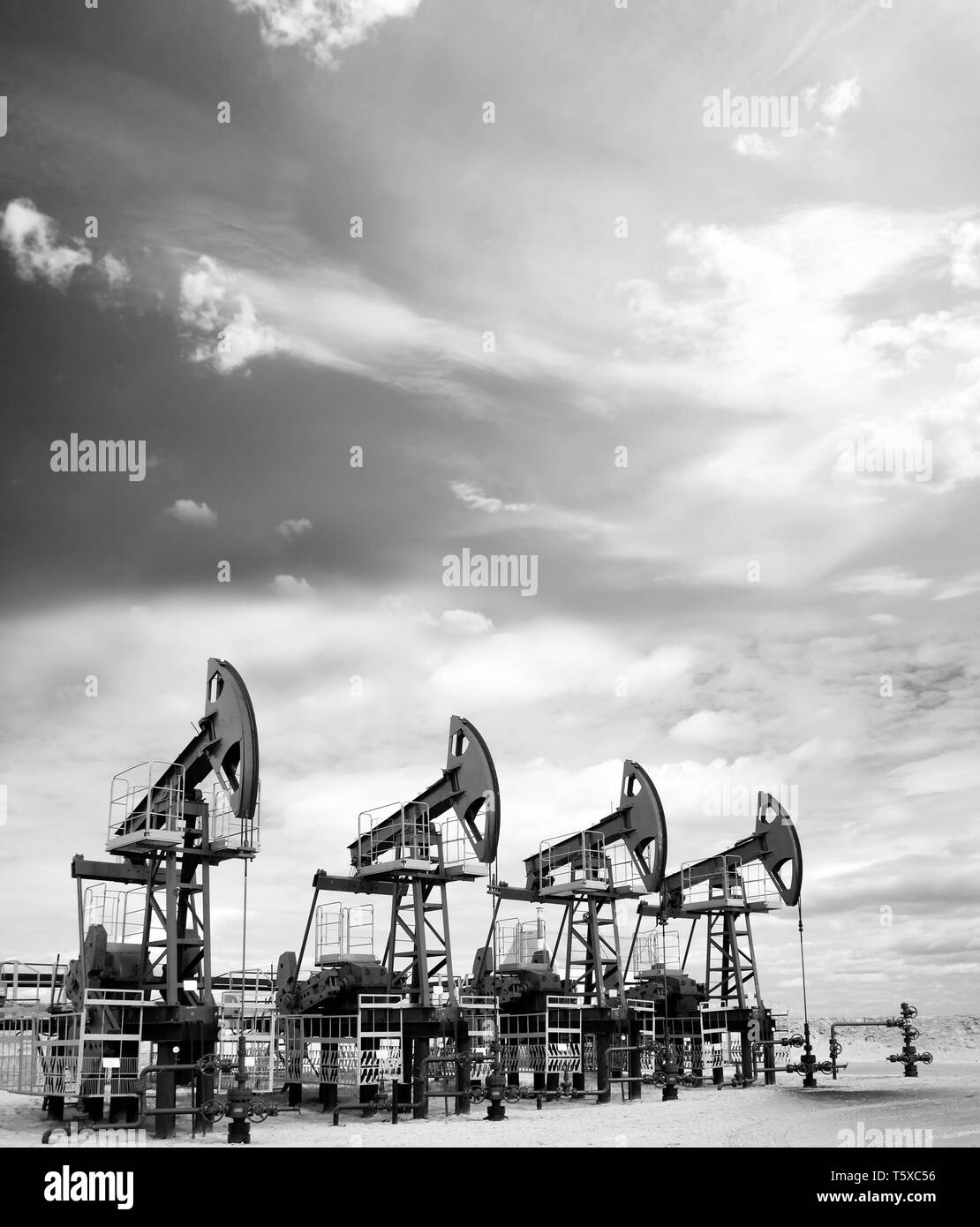 Oil industry and gas industry. Oil equipment. Blue sky and white clouds ...
