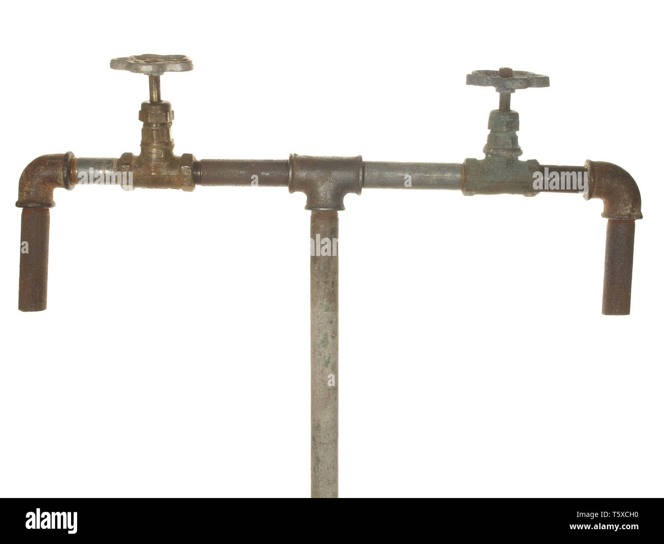 A fragment of the old water conduit consisting of pipes, fittings and ...