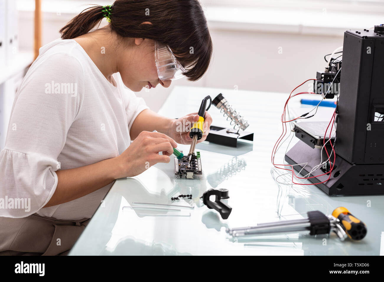 Lady working in welding factory hi-res stock photography and images - Alamy