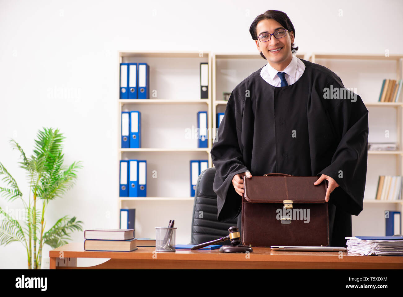Young handsome judge working in court Stock Photo - Alamy