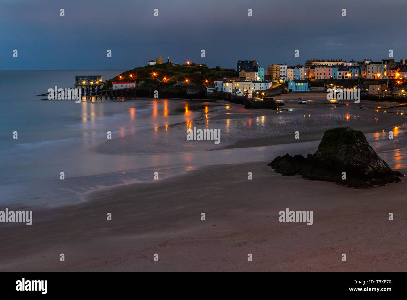 Tenby North Beach and Goscar Rock at night Stock Photo - Alamy