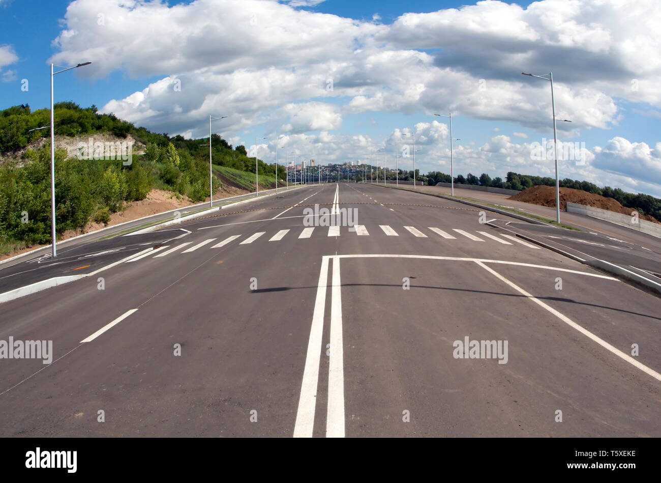 Round street in empty town. Blue sky and white cloud. Wide angle Stock ...
