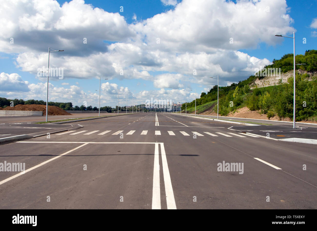 Empty street in empty town. Blue sky and white cloud Stock Photo - Alamy