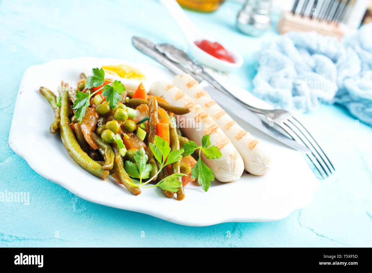 sausages and vegetables for dinner on plate Stock Photo - Alamy