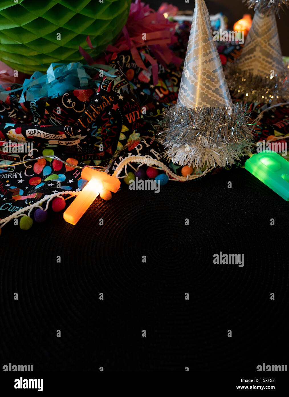 Birthday party themed dark background Stock Photo - Alamy