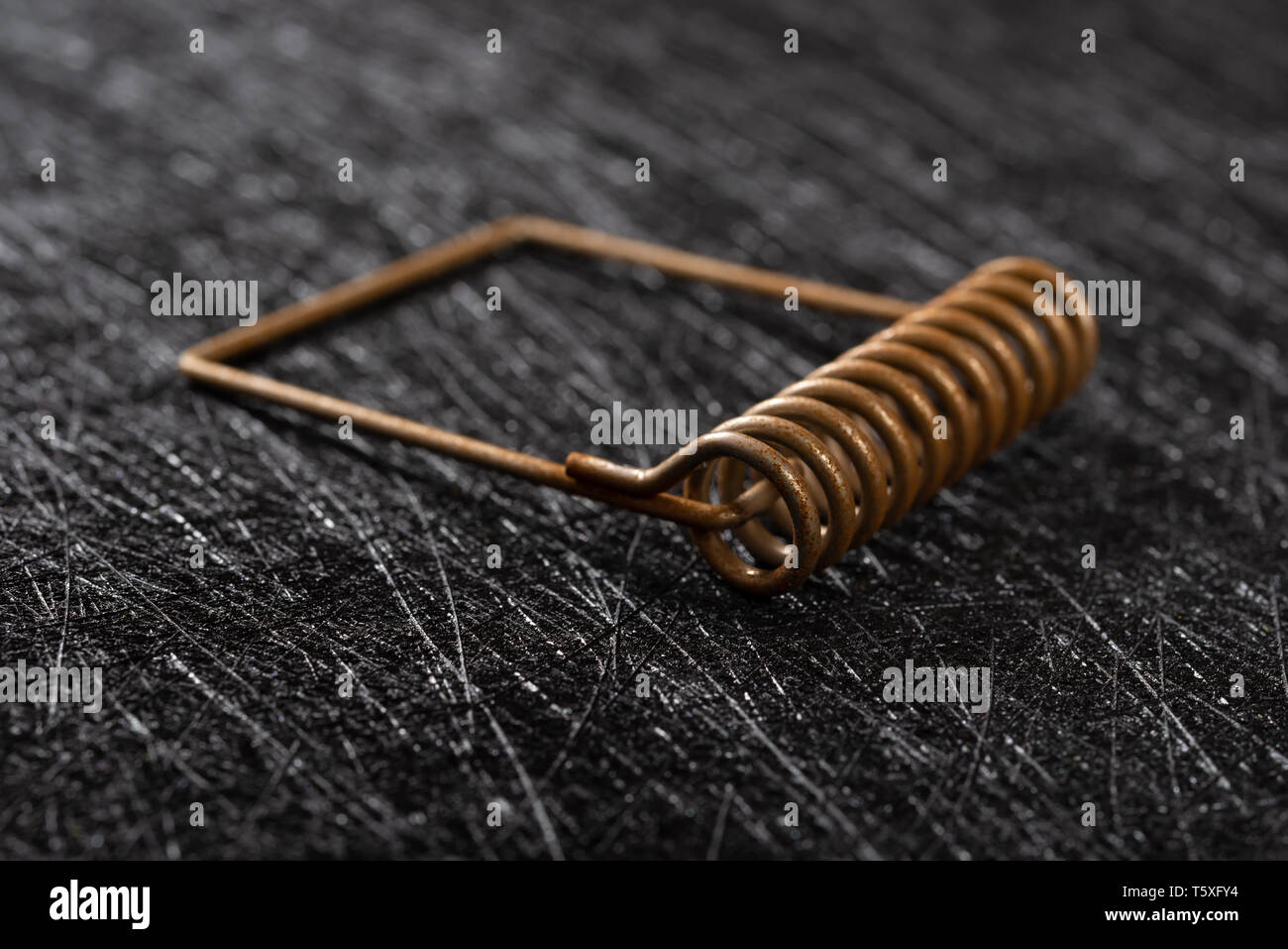 side view rusty spring on dark background Stock Photo - Alamy