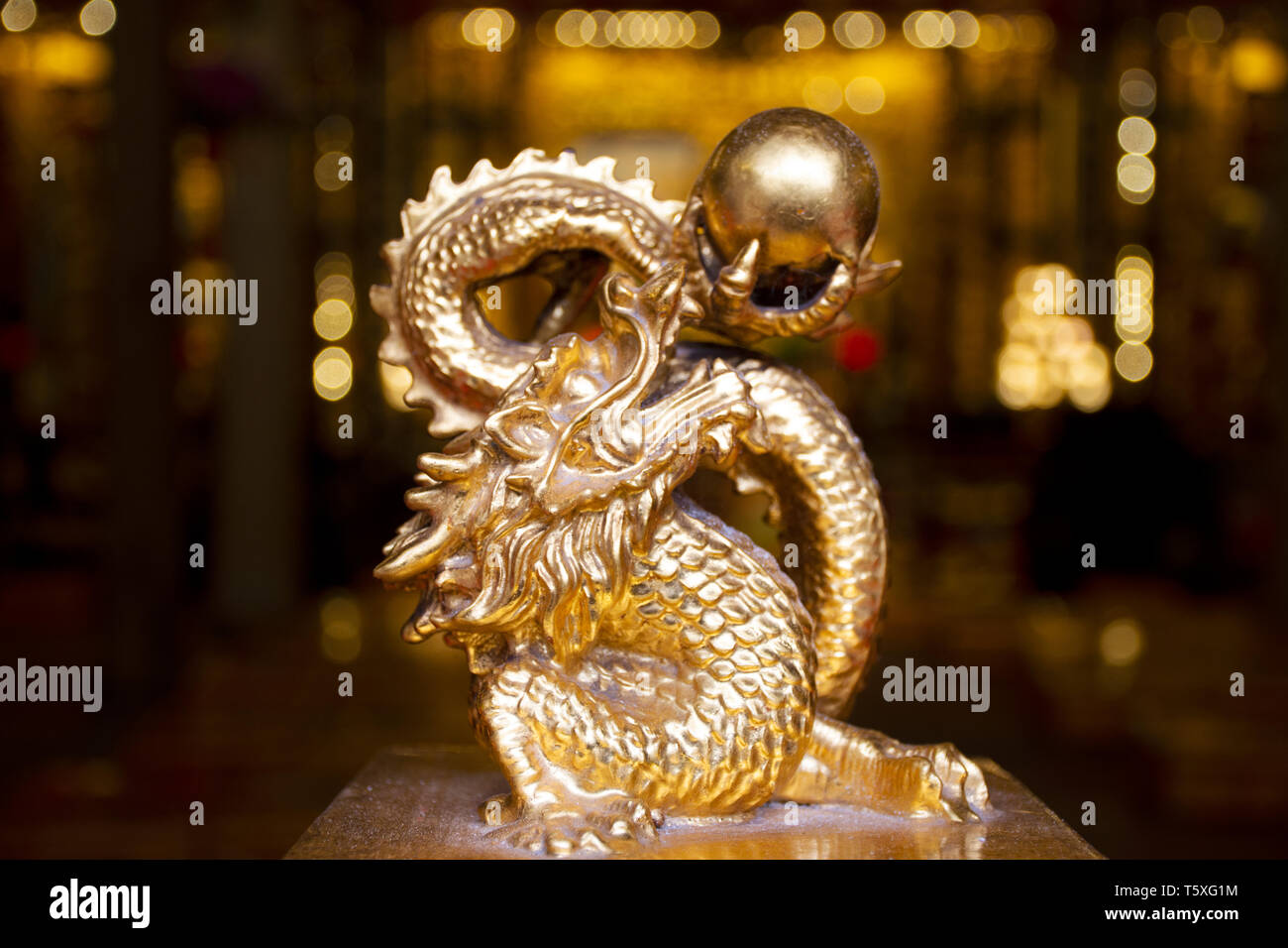 Golden dragon statue with gold ball inside Guandi shrine and Jinping ...