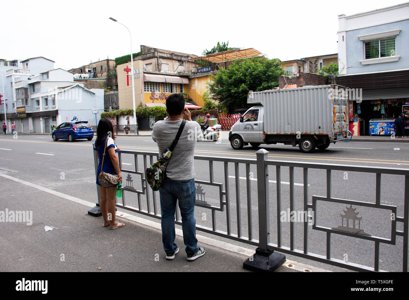 Chinese people drive and ride and bike on the road and foreigner ...