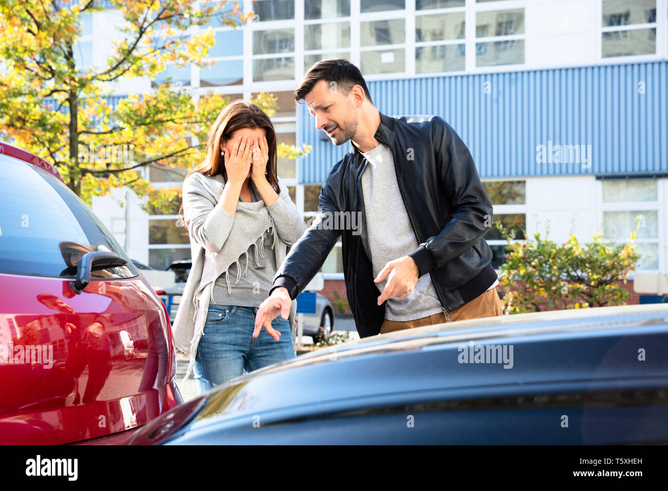 Young Man And Woman Arguing With Each Other After Car Accident On ...