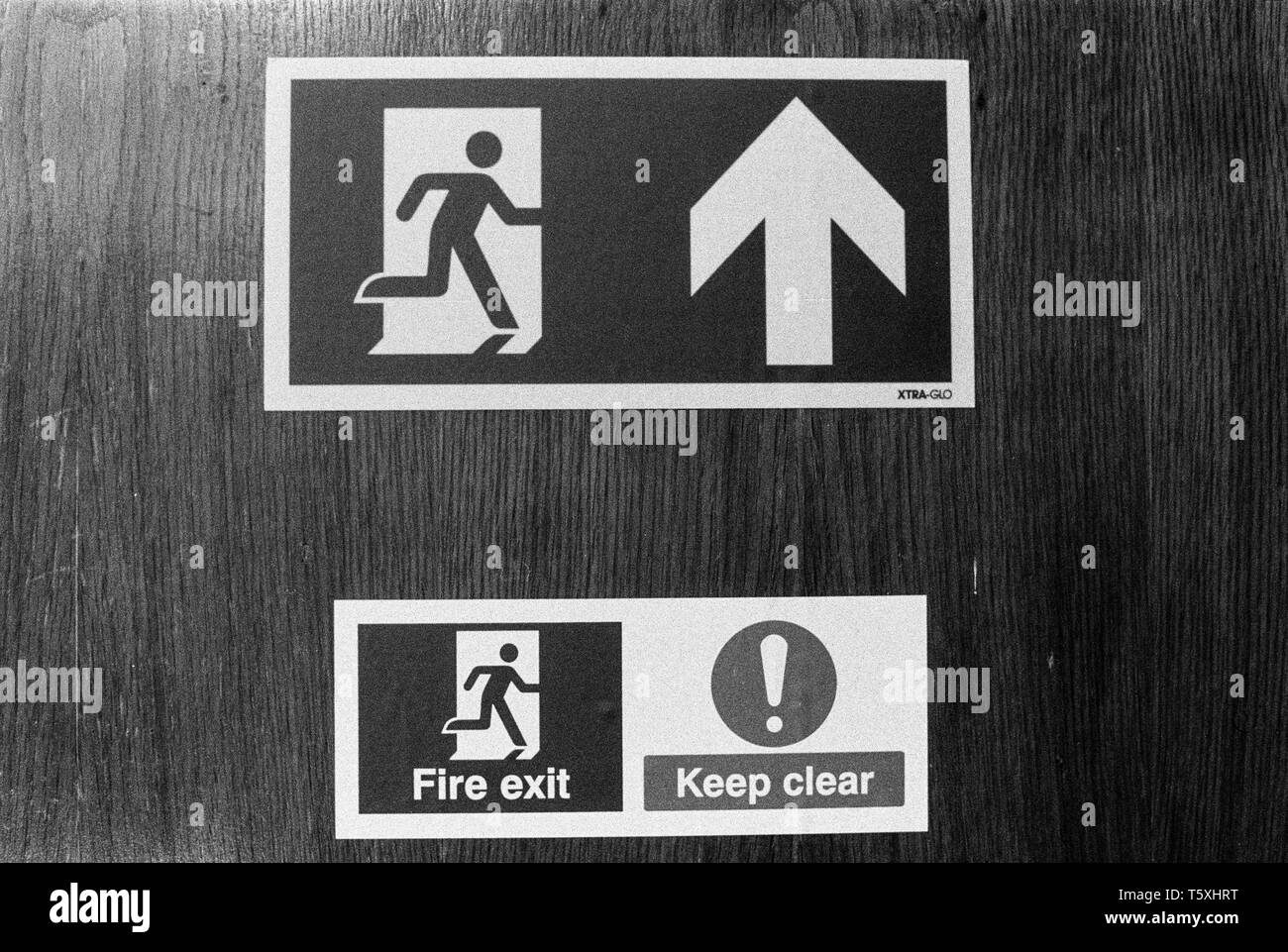 Fire exit sign uk Black and White Stock Photos & Images - Alamy
