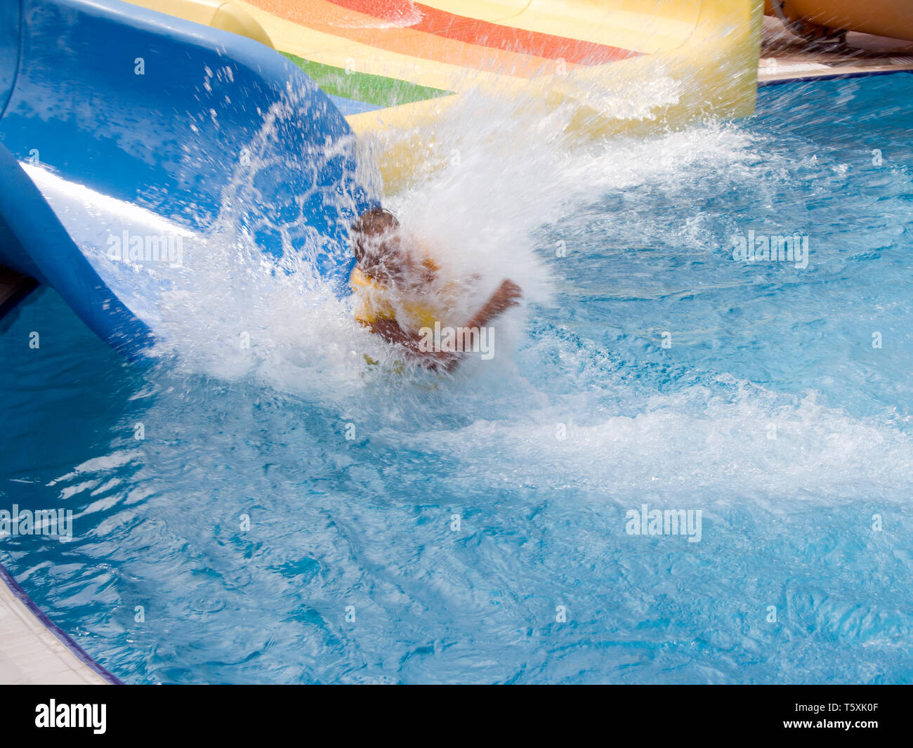 Jump in water from waterslide Stock Photo - Alamy