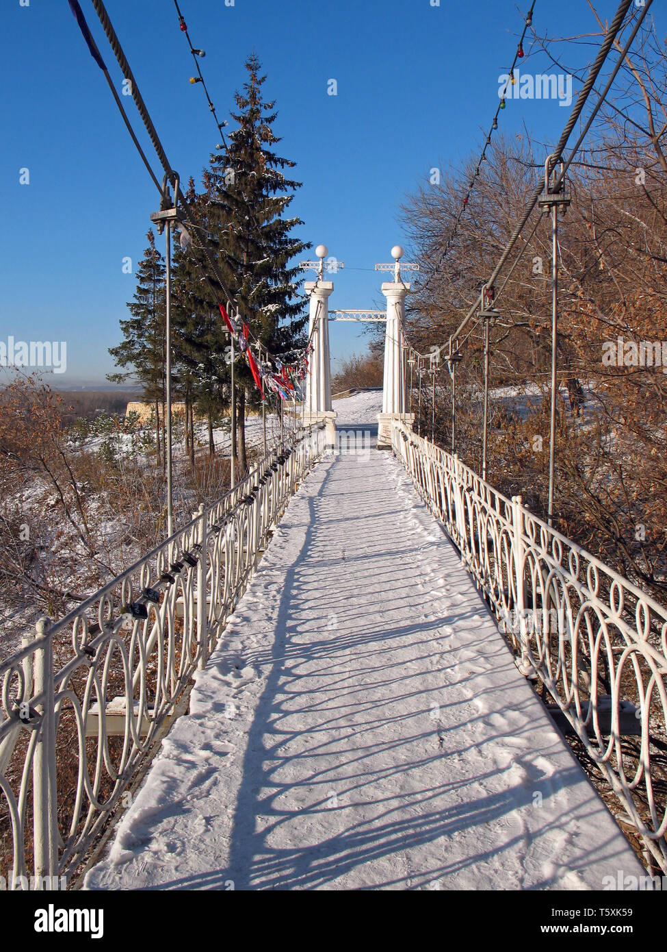 Little bridge under slope in the park Stock Photo - Alamy