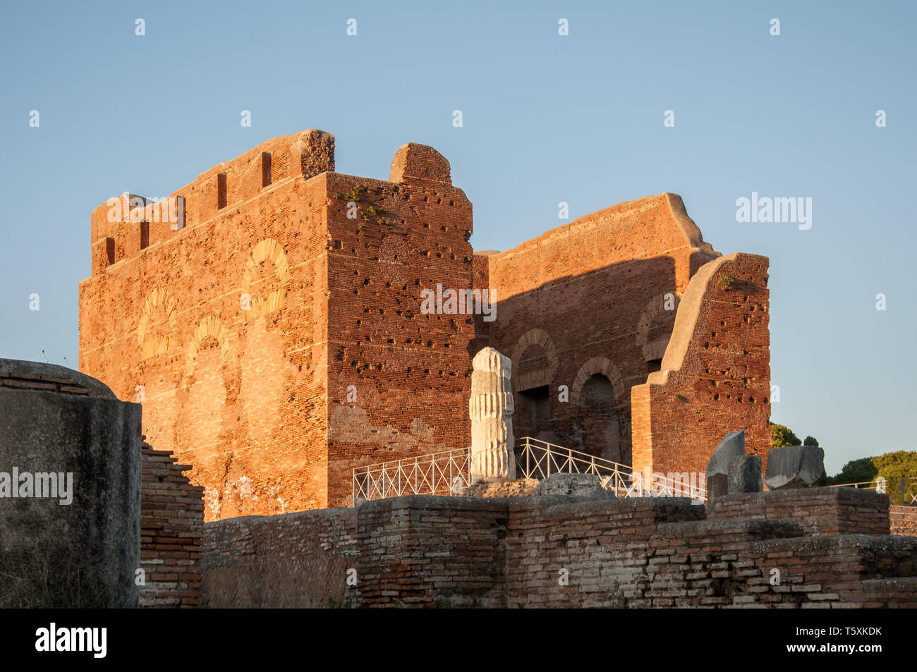 View of the Capitolium of Ostia Antica at sunset, archaeological site ...