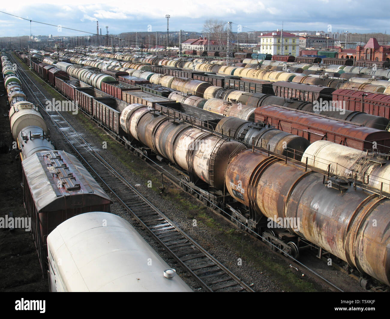 Rail cars on a big railway station. Loading Stock Photo - Alamy