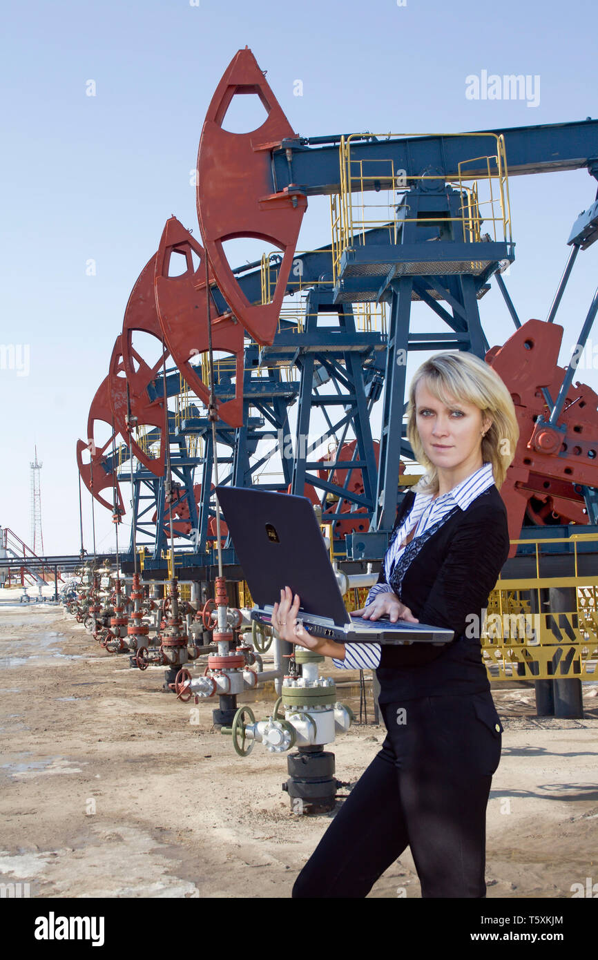 Work of young business women in oil industry Stock Photo - Alamy