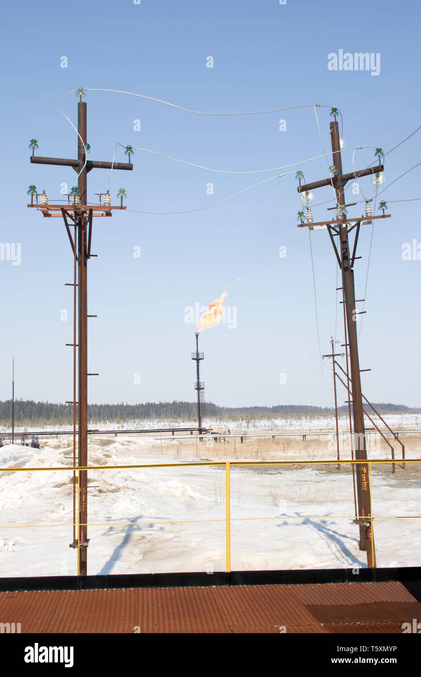 Electric wires about power station on an oil deposit Stock Photo - Alamy