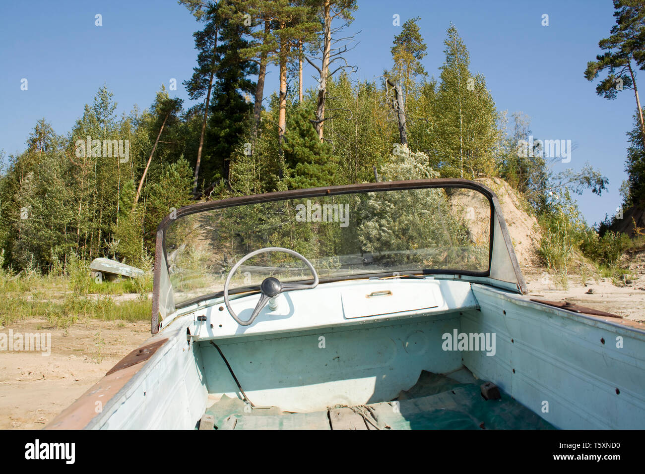 Old motorboat on a coast of river Stock Photo - Alamy