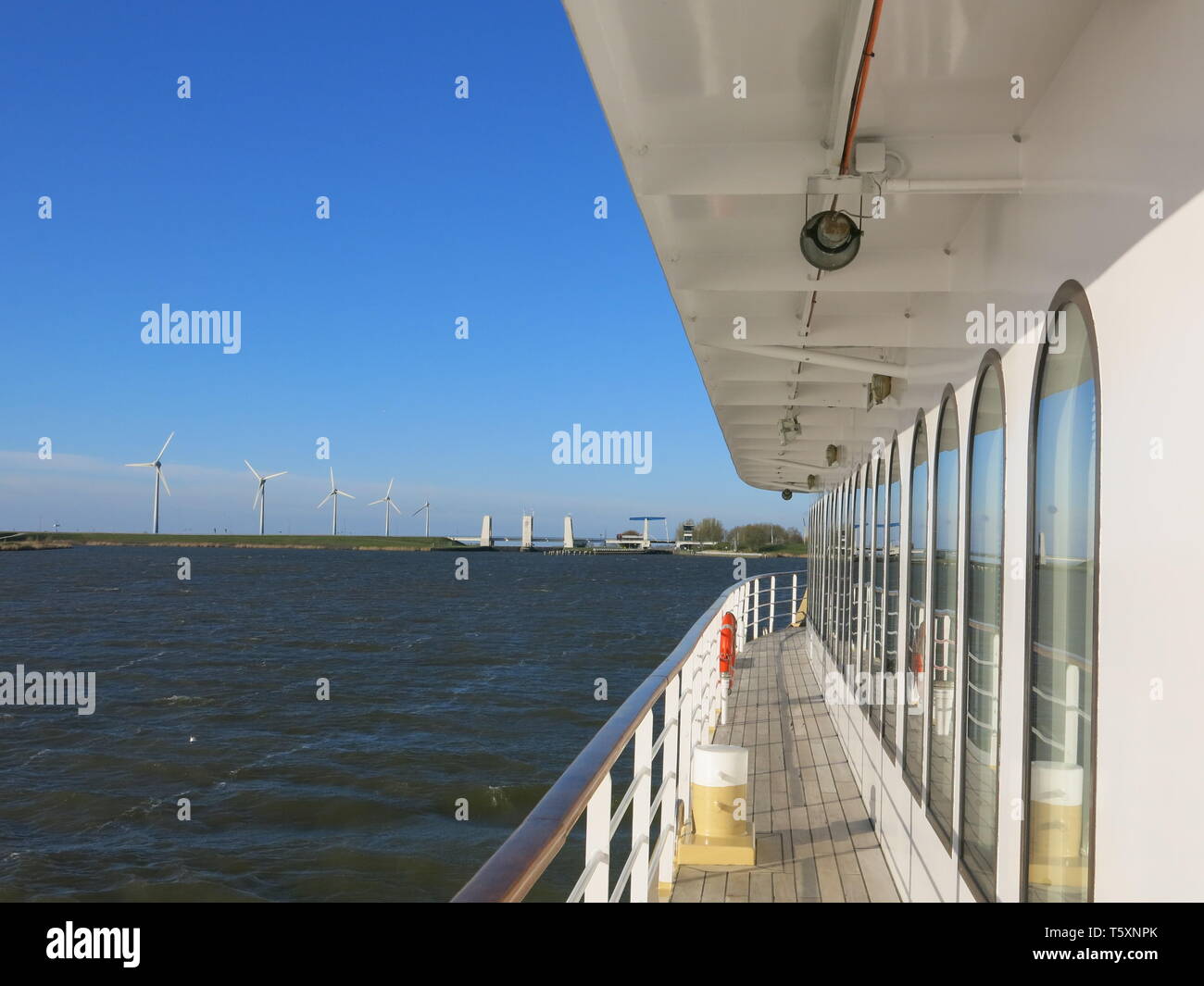 The outside starboard walkway of a cruise ship at sea, looking back ...