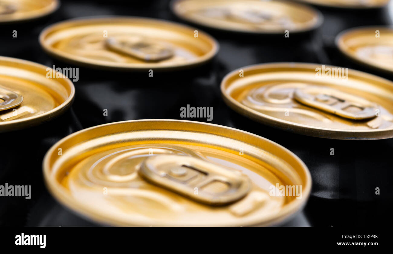 Close up photo of aluminum cans in a raw. Aluminium can background. Can ...