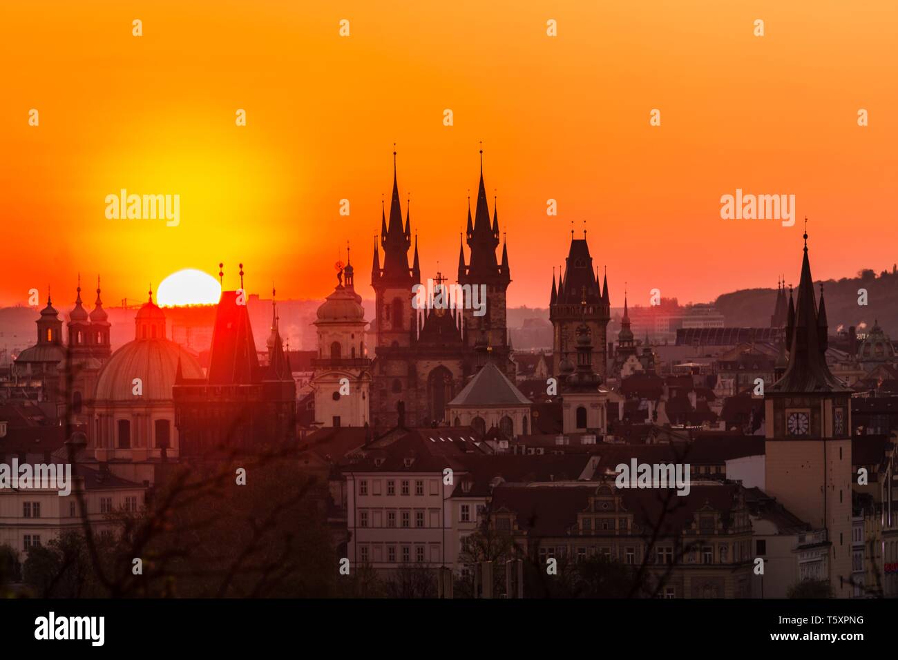 View of orange and pink sky during morning sunrise in Prague, capital ...