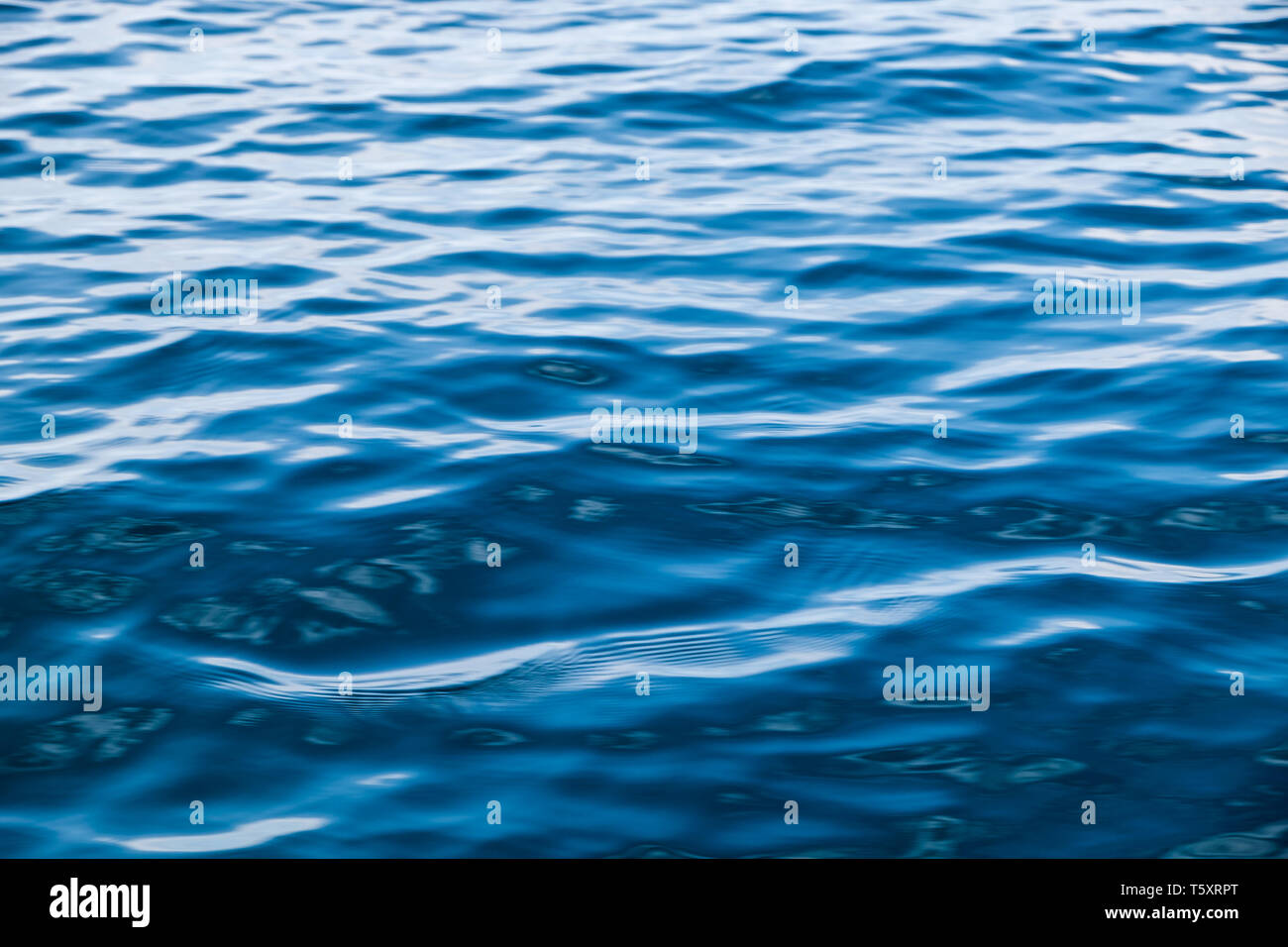Blue wave ripple sea texture background Stock Photo - Alamy