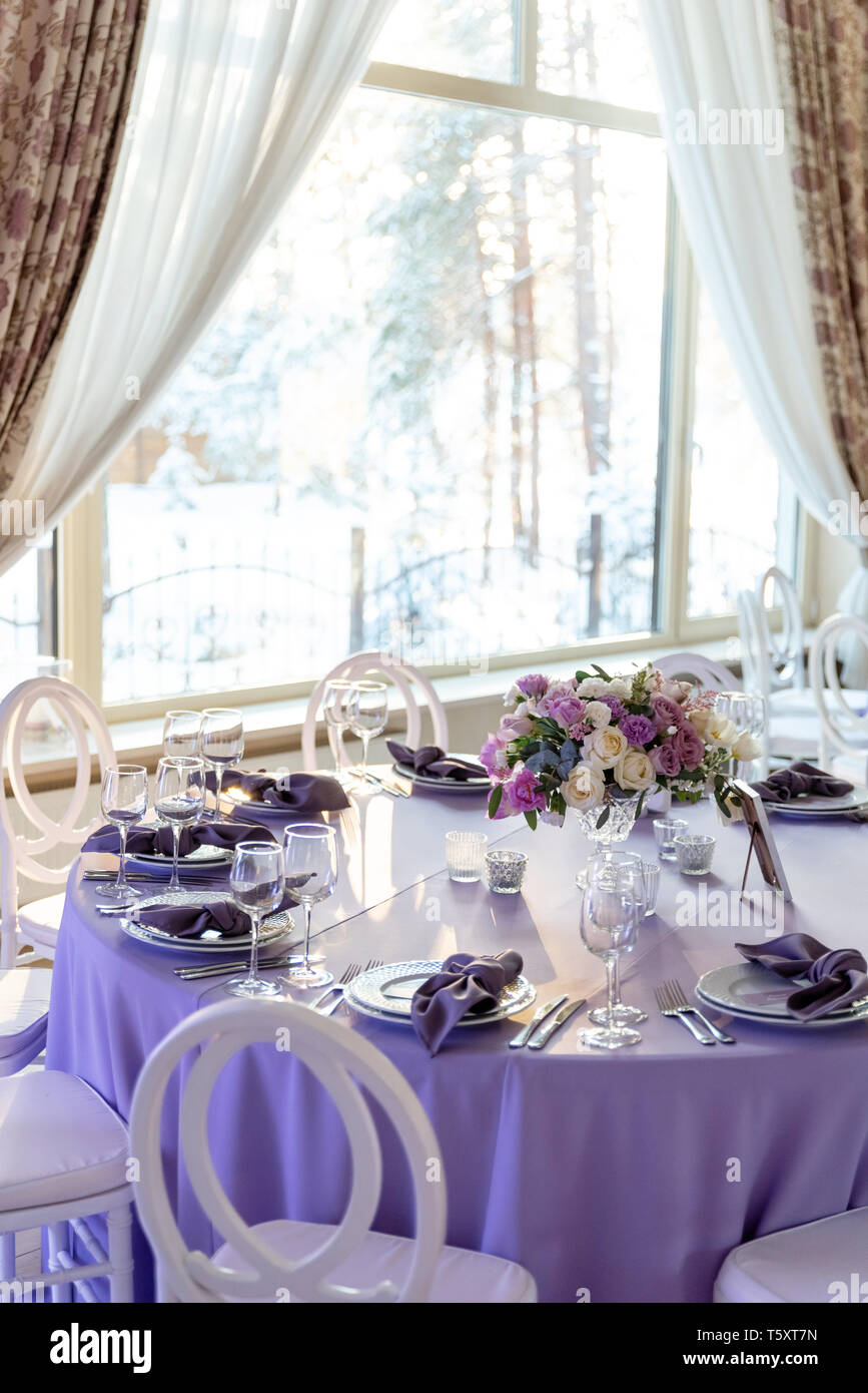 Magnificent table appointments of a holiday table. A wedding banquet at ...