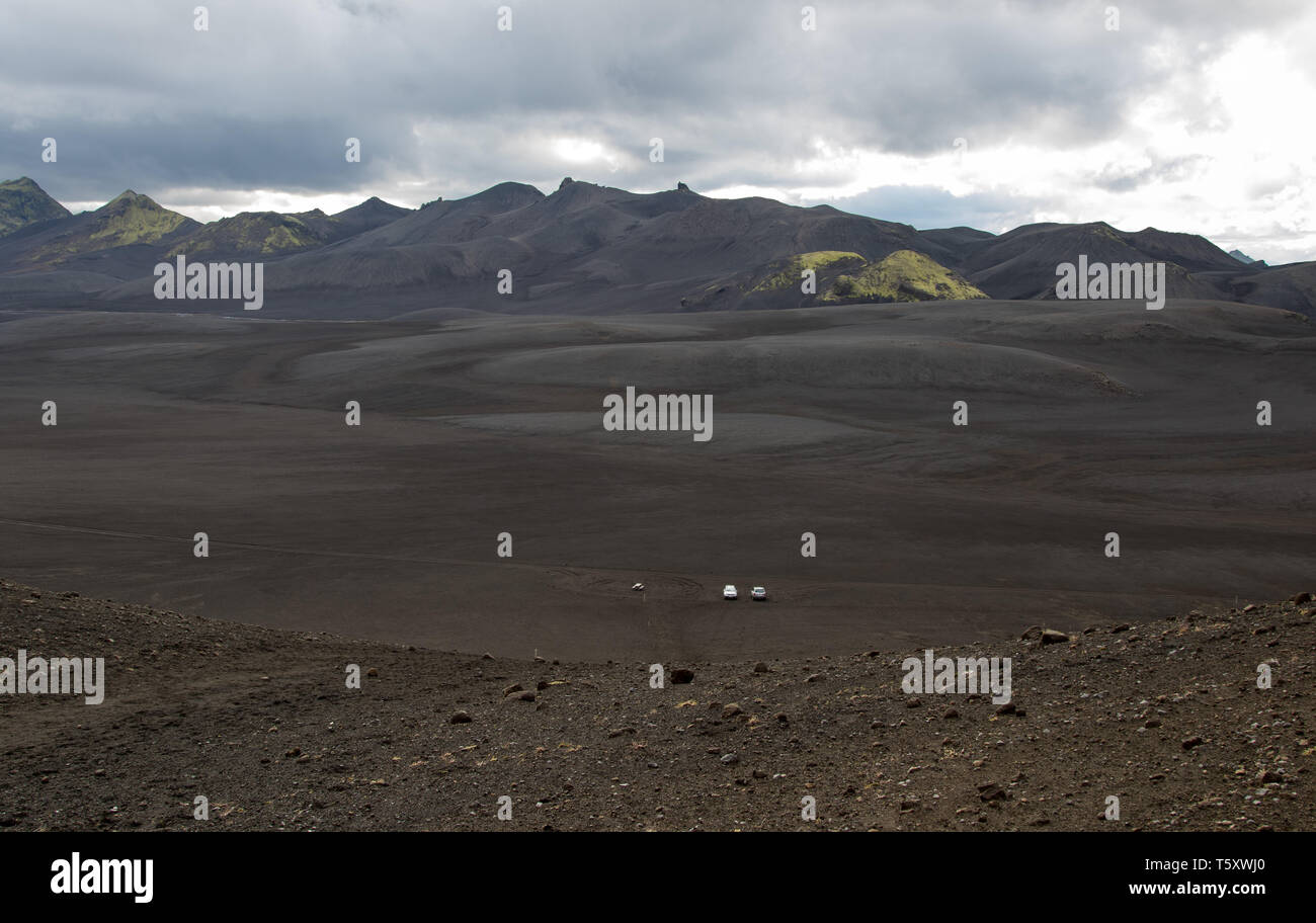 Dramatic iceland landscape with a green hill and black lava looks like ...